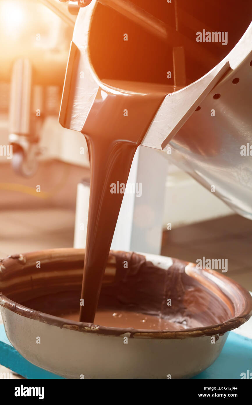 Tank pouring liquid into basin Stock Photo - Alamy
