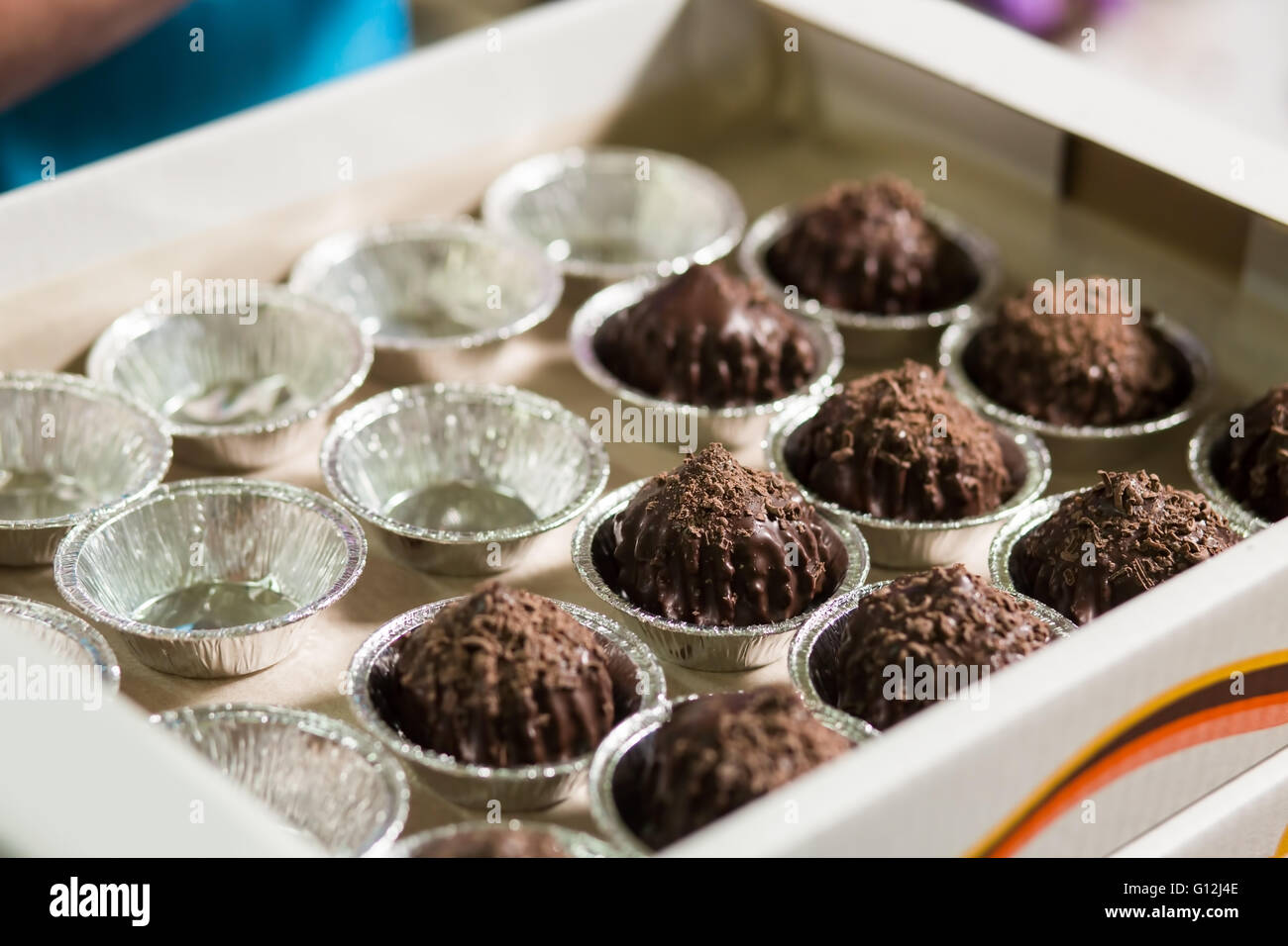 Brown sweets in small cups Stock Photo - Alamy