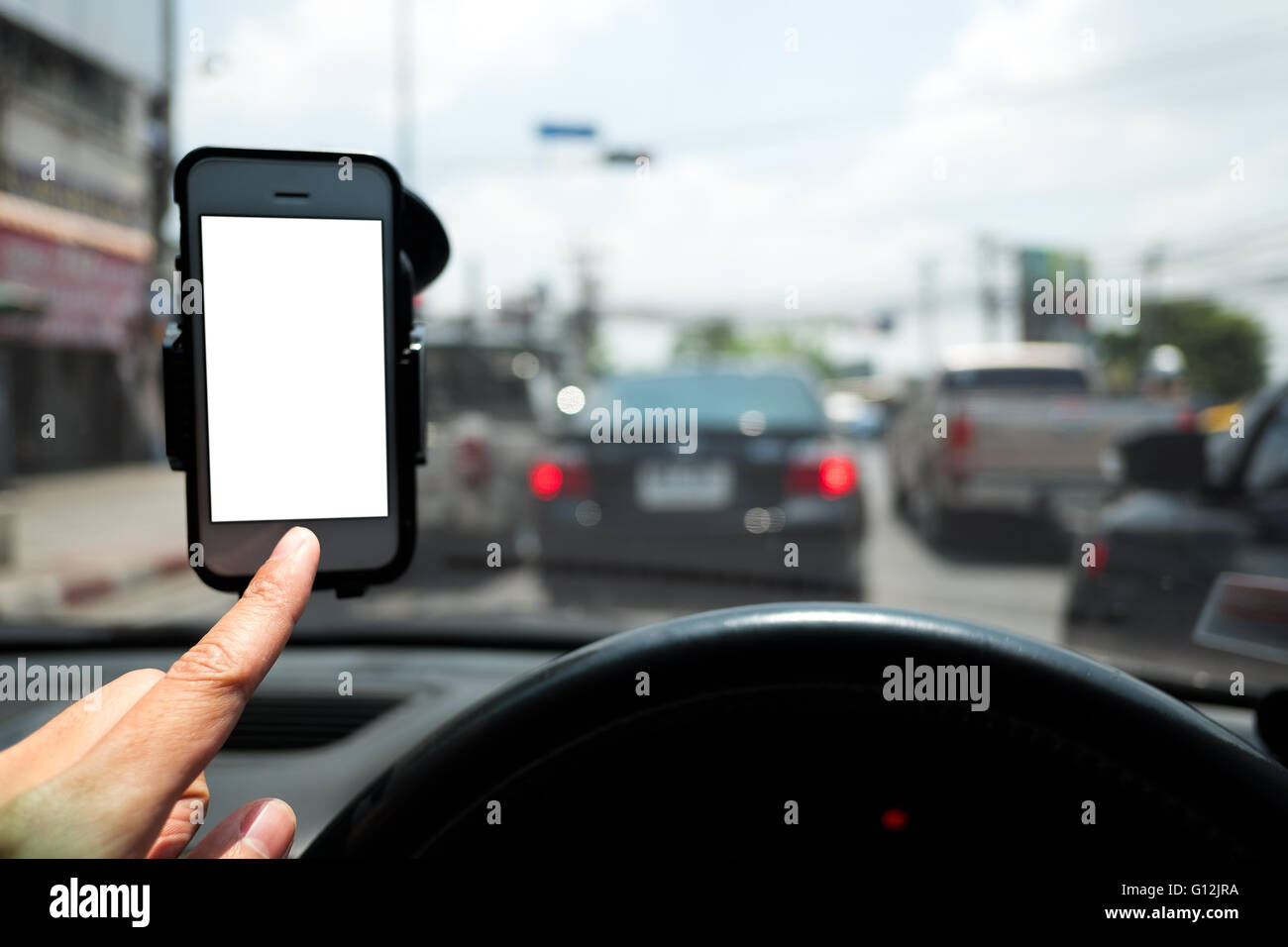 hand and smartphone in a car use for Navigate Stock Photo - Alamy