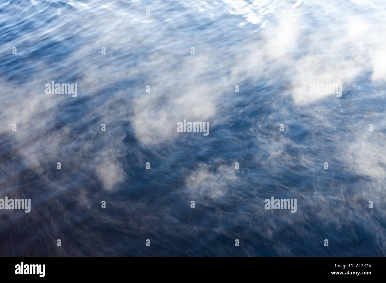 Water vapor on surface of cold water Stock Photo - Alamy