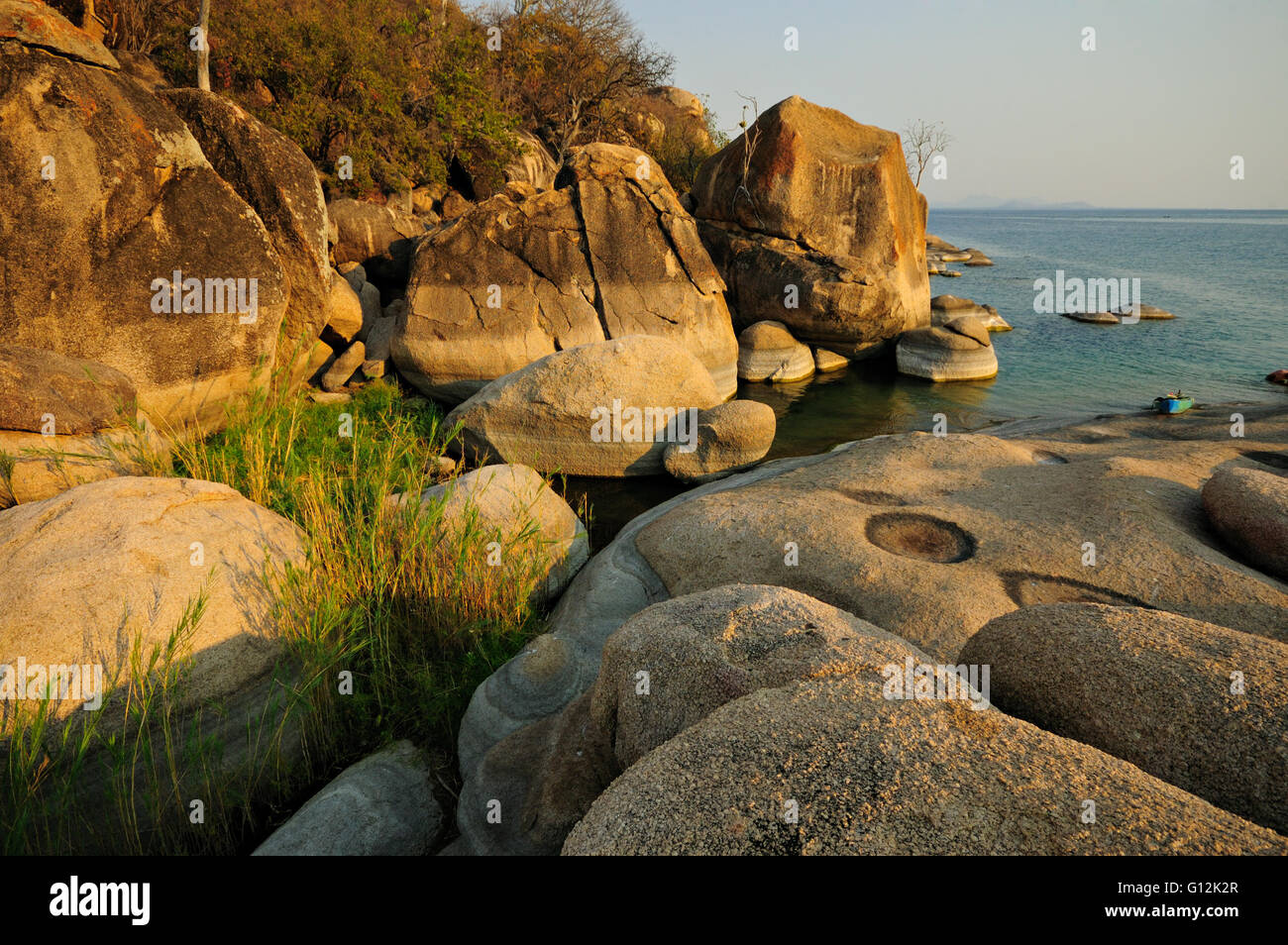 Rounded rocks at Otter Point at sunset, Lake Malawi National Park Stock ...