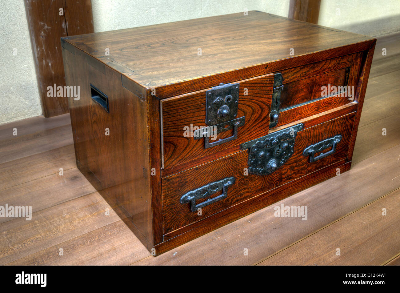 Traditional japanese ornated wooden brown chest Stock Photo - Alamy