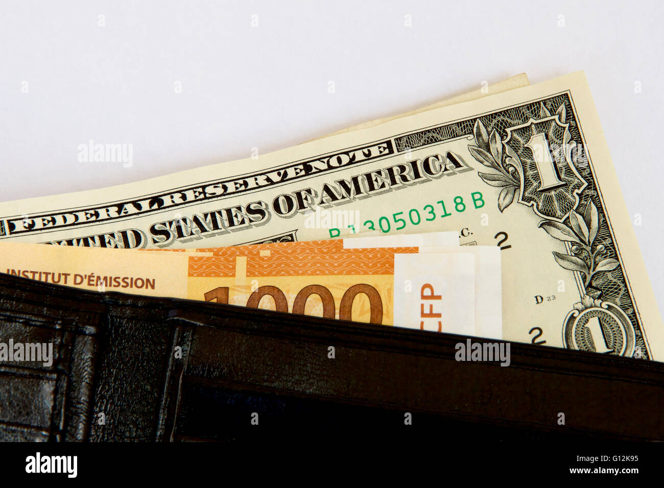 French Polynesian francs and American dollars in a black wallet Stock ...