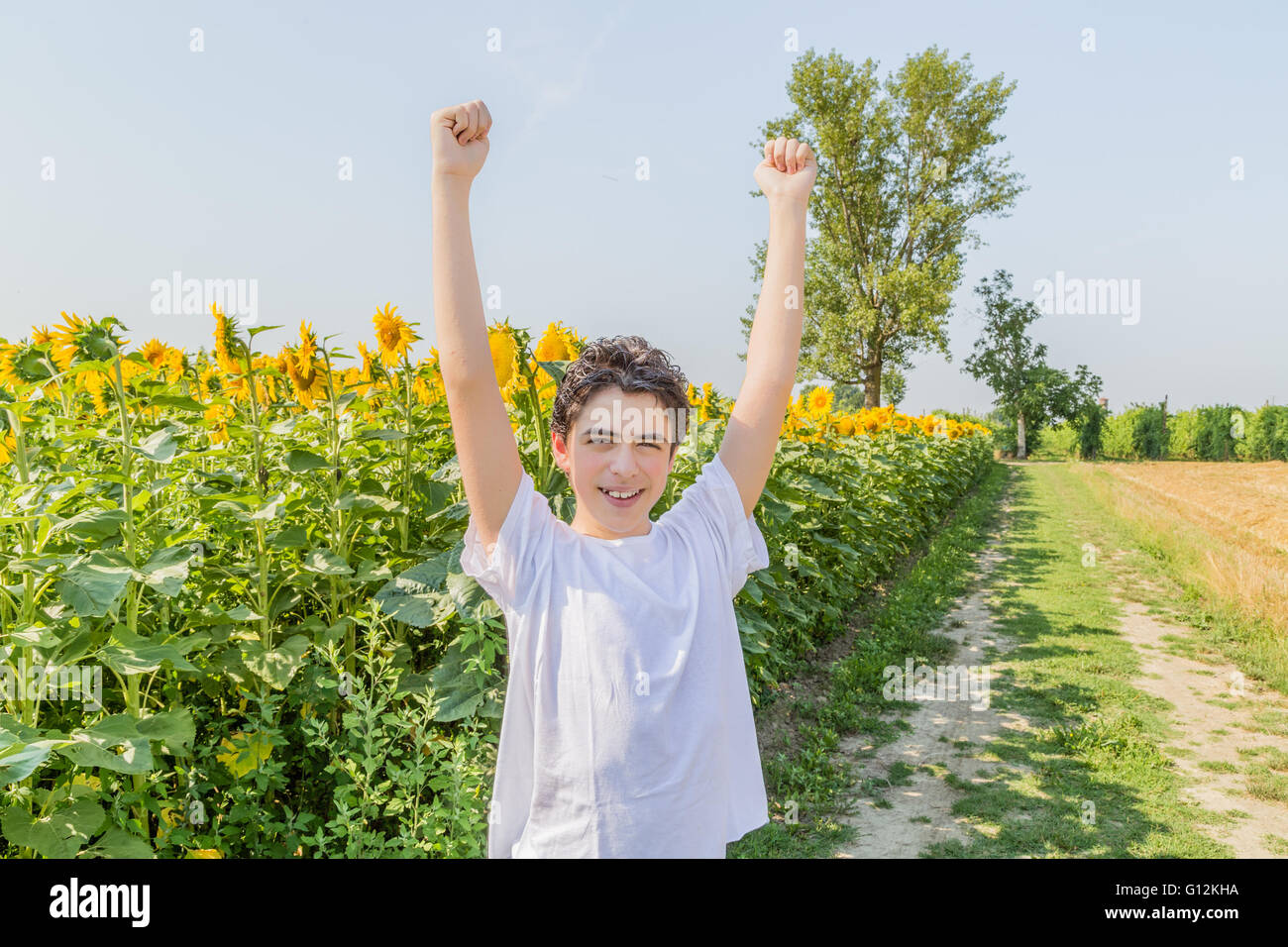 Open air and open arms, Caucasian boy is raising his arms in front of ...
