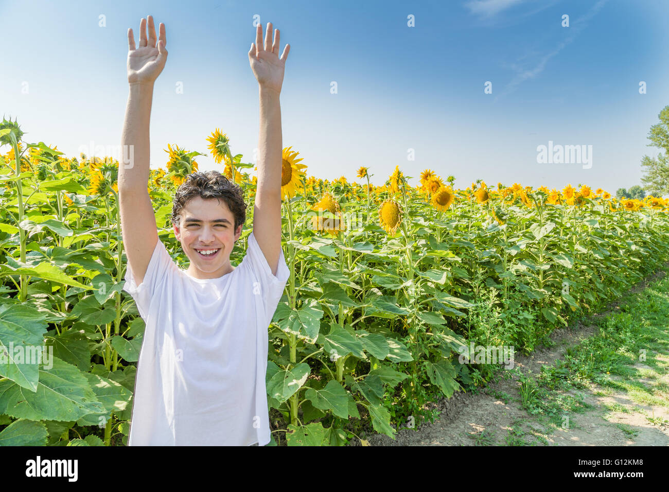 Open air and open arms, Caucasian boy is raising his arms in front of ...