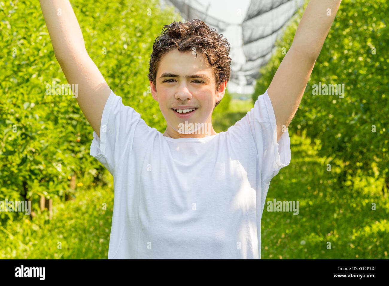 Boy under apple tree hi-res stock photography and images - Alamy