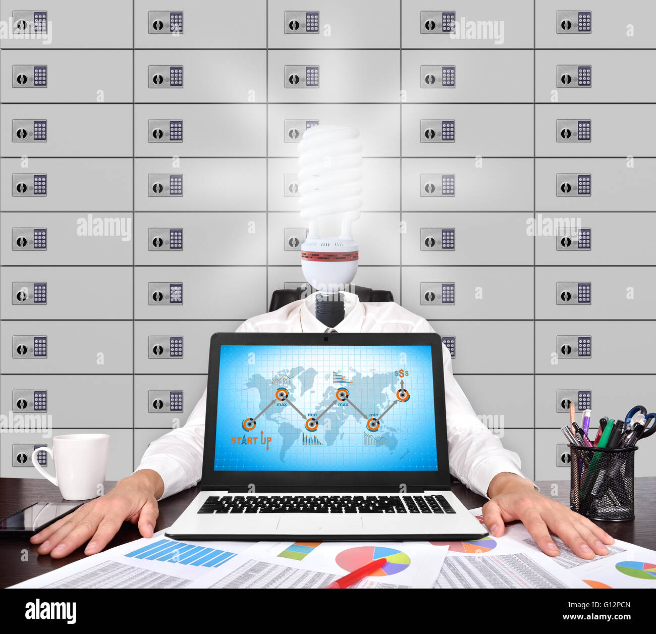 Businessman with head lamp sitting in office. Start up concept on ...