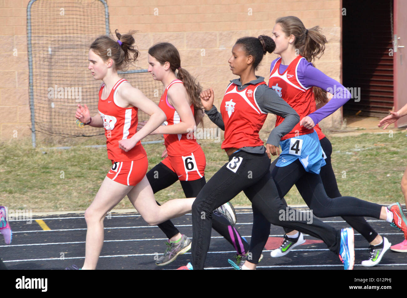 Girls running in a track meet Stock Photo - Alamy
