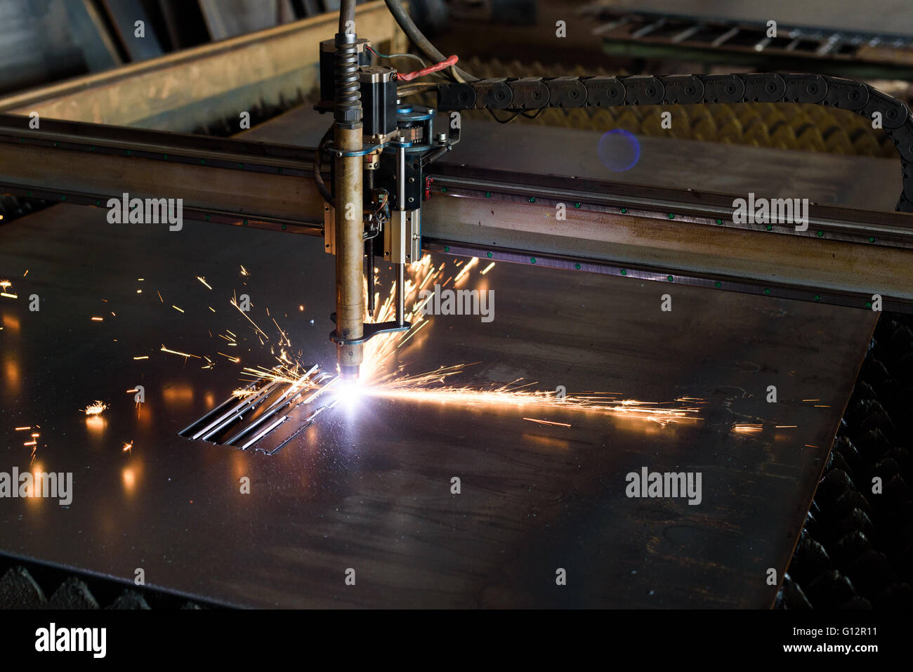 Metal grinding with bright orange flying sparks Stock Photo - Alamy