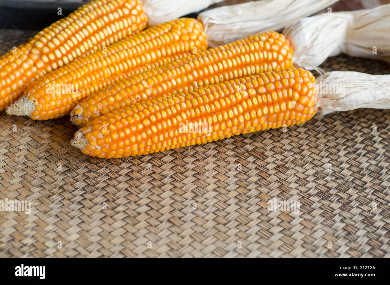 Corn dry on bamboo background Stock Photo - Alamy