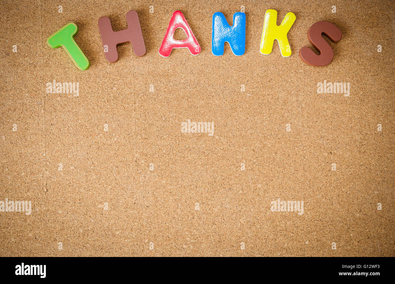 Colorful Wooden word THANKS on cork board Stock Photo - Alamy