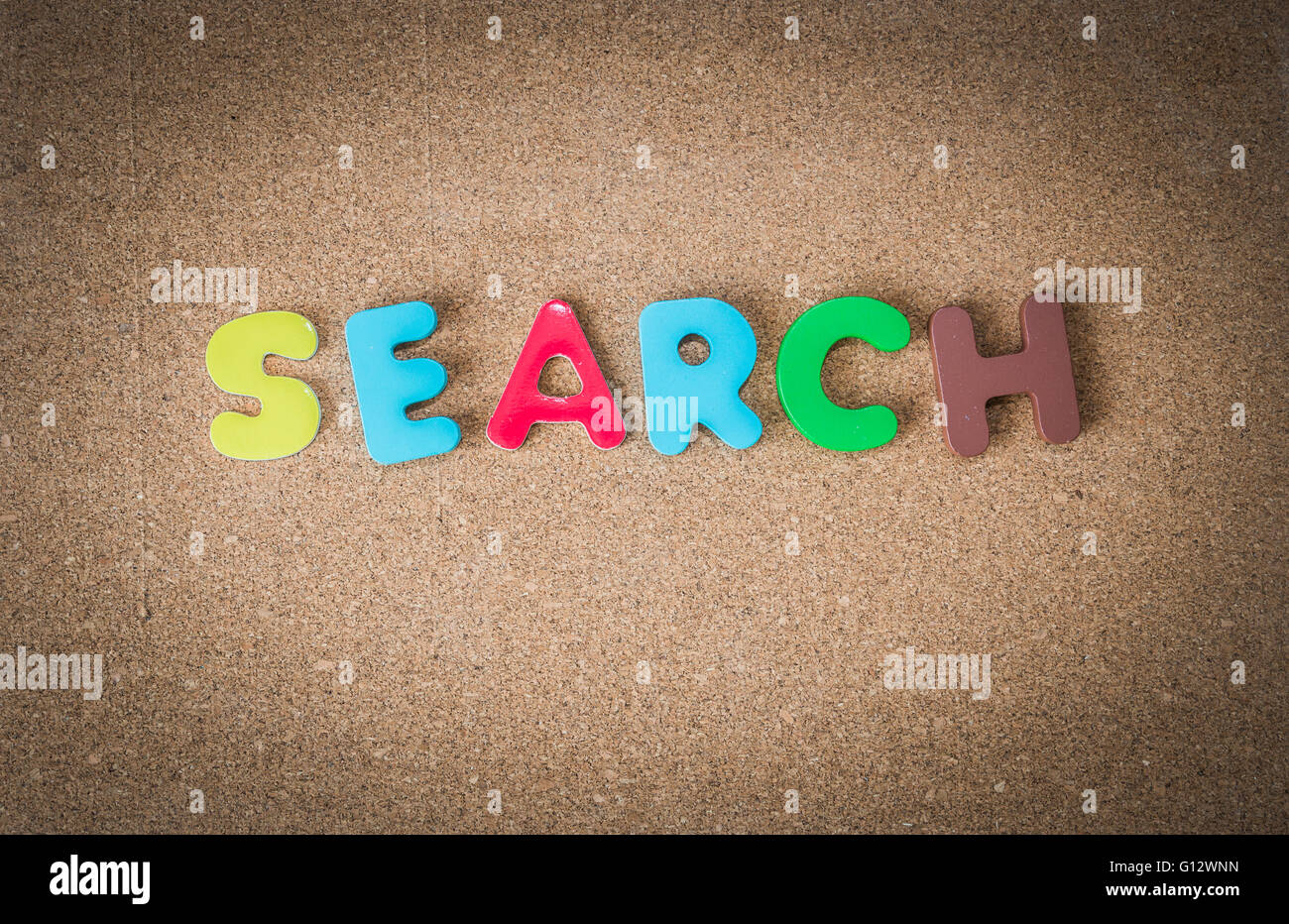 Colorful Wooden word SEARCH on cork board Stock Photo - Alamy