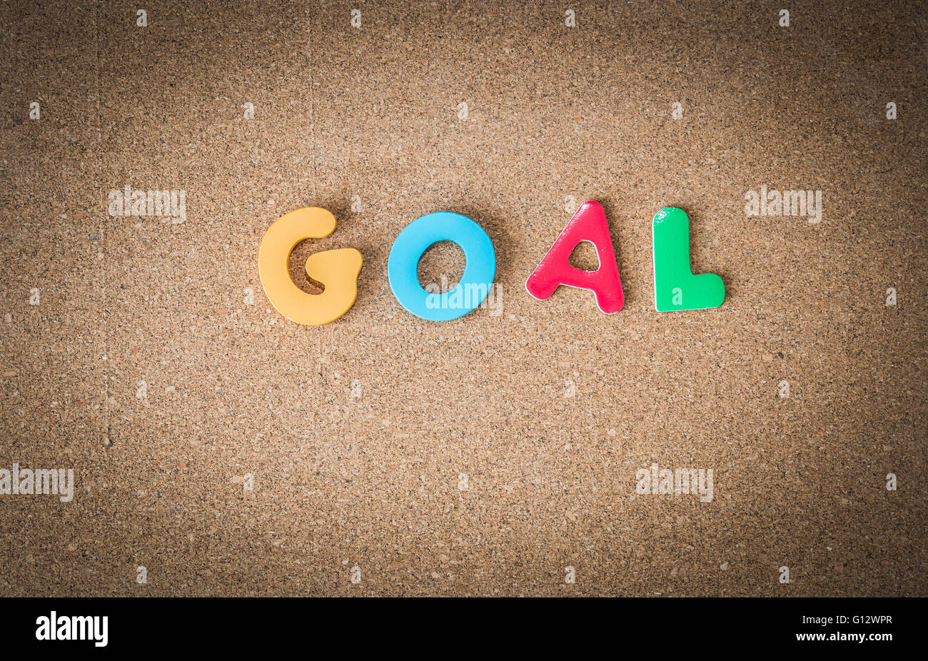 Colorful Wooden word GOAL on cork board Stock Photo - Alamy