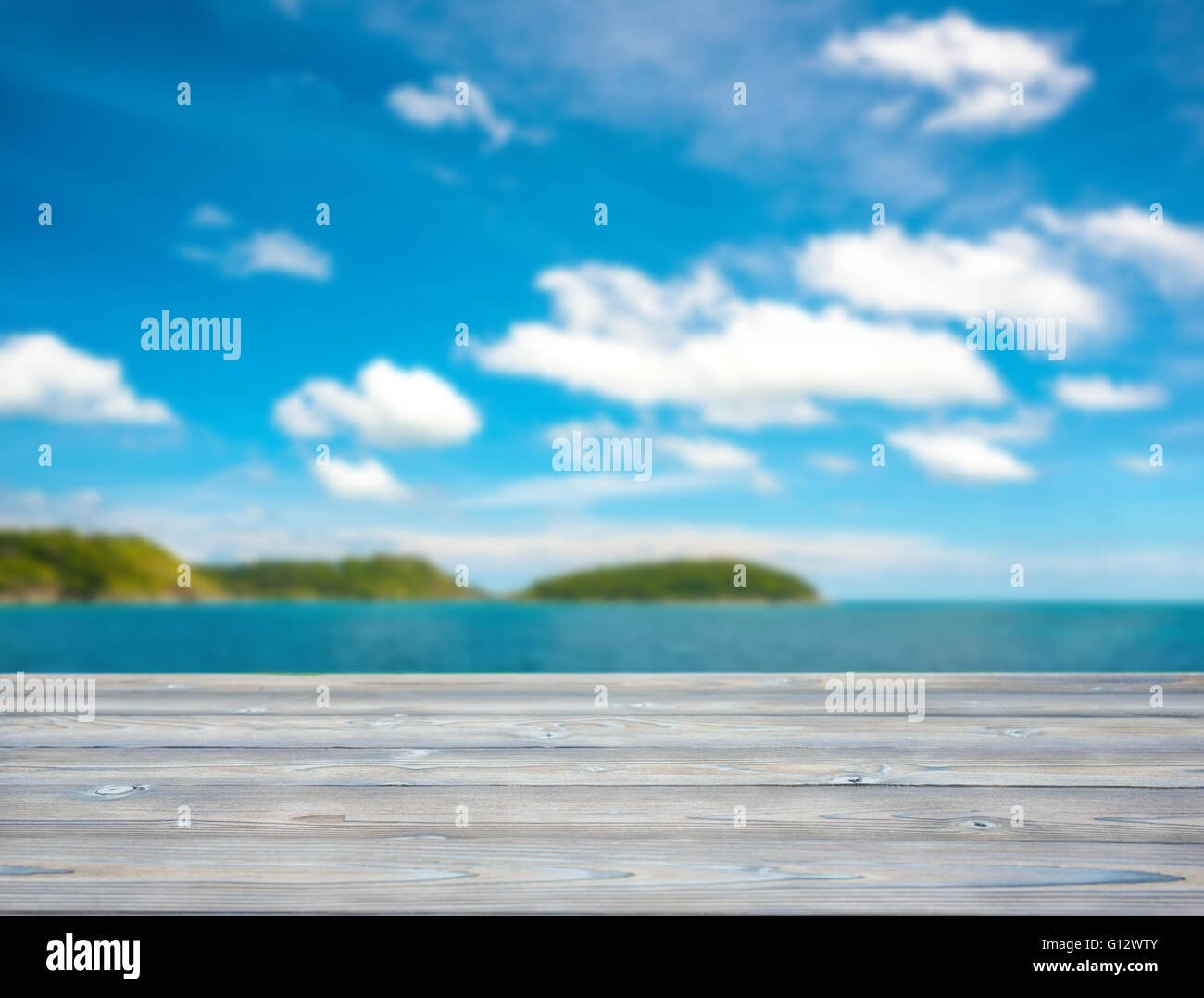 wooden empty table over beautiful tropical seascape with islands at ...