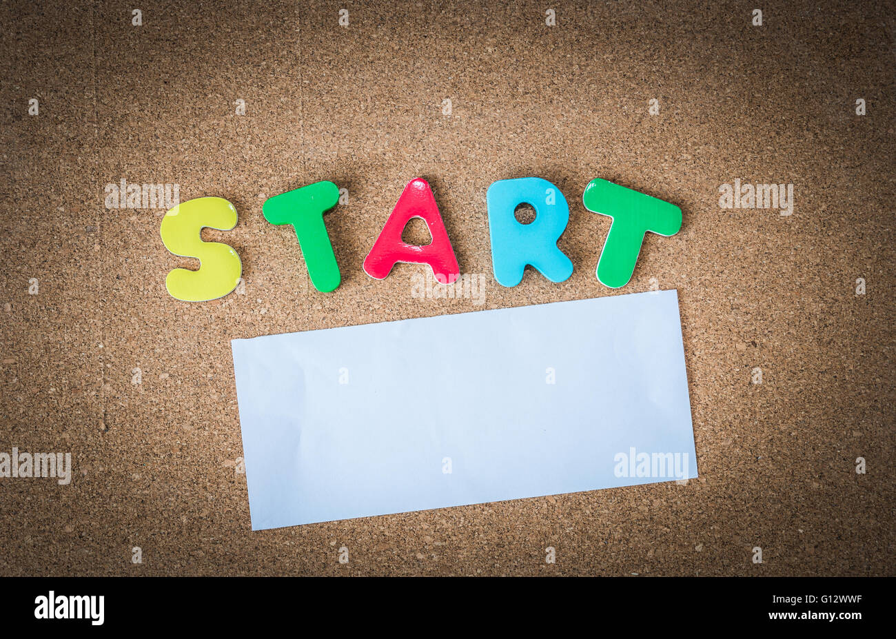 Colorful Wooden word START with white paper on cork board Stock Photo ...