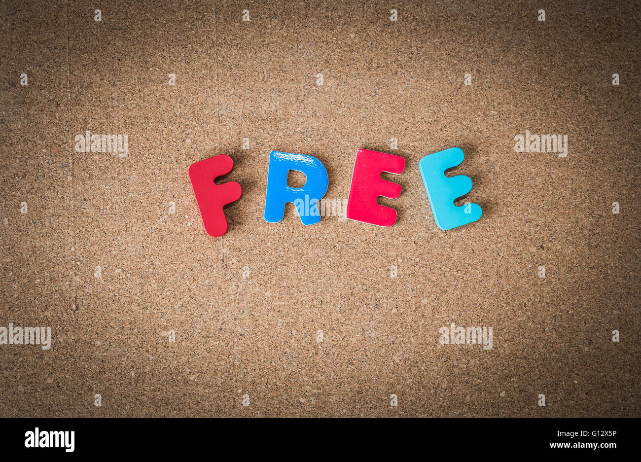Colorful Wooden word FREE on cork board Stock Photo - Alamy