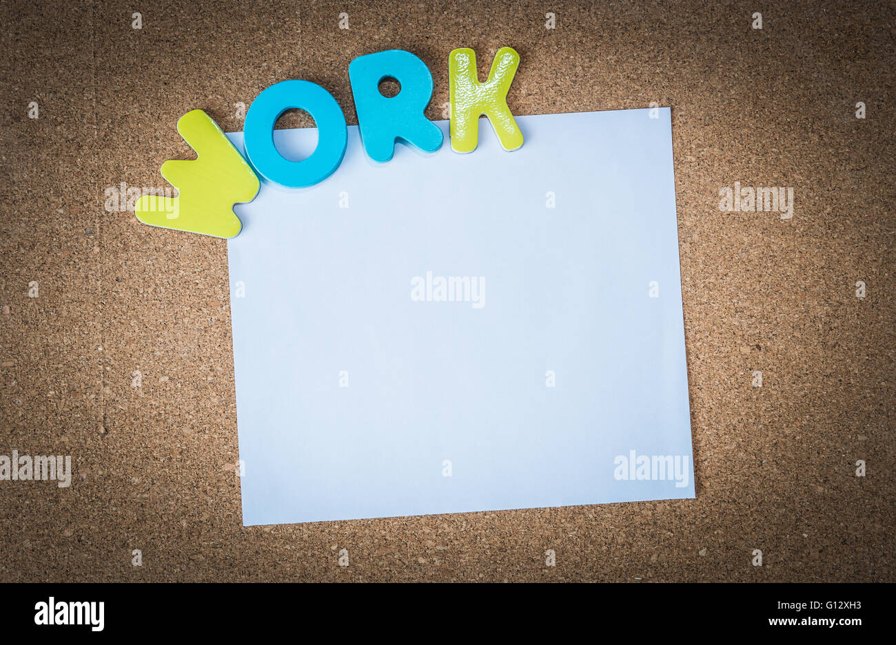 Colorful Wooden word WORK with White paper on cork board Stock Photo ...