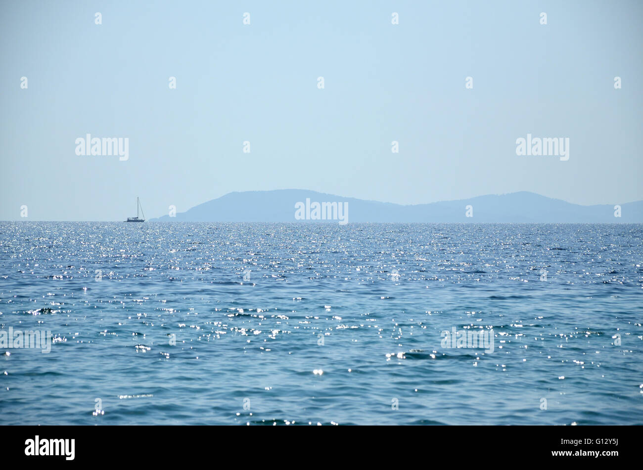 Sailboat sailing across blue hi-res stock photography and images - Alamy