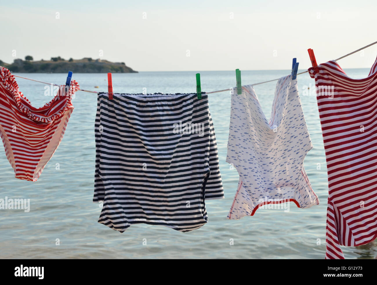 Clothes drying clipped to the rope on the beach Stock Photo - Alamy