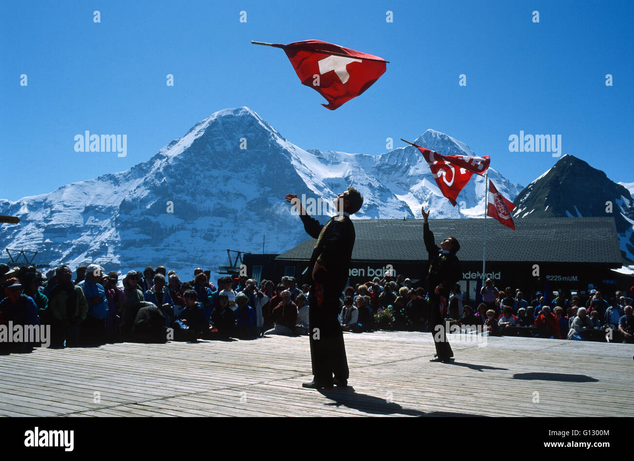 Flag throwing and Eiger Mannlichen Switzerland Stock Photo - Alamy