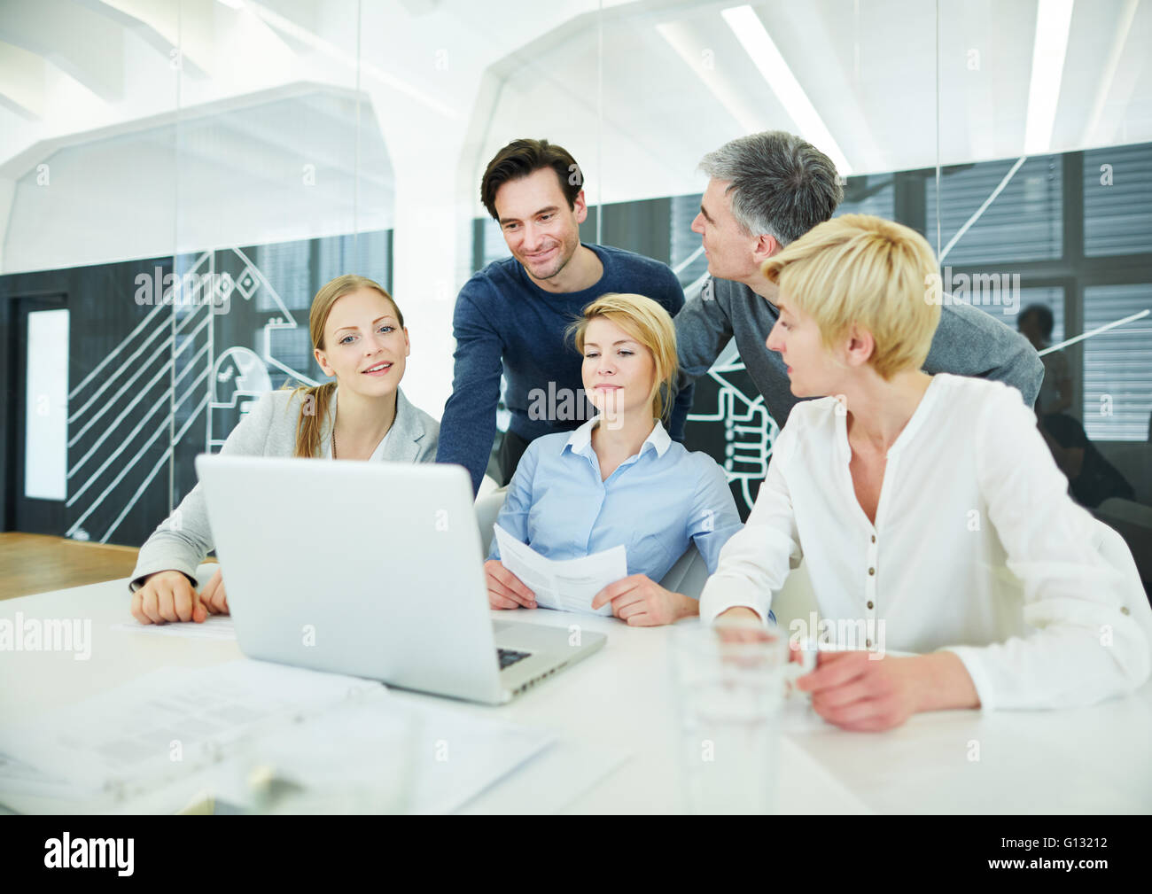 Business team having training at computer in the office Stock Photo - Alamy