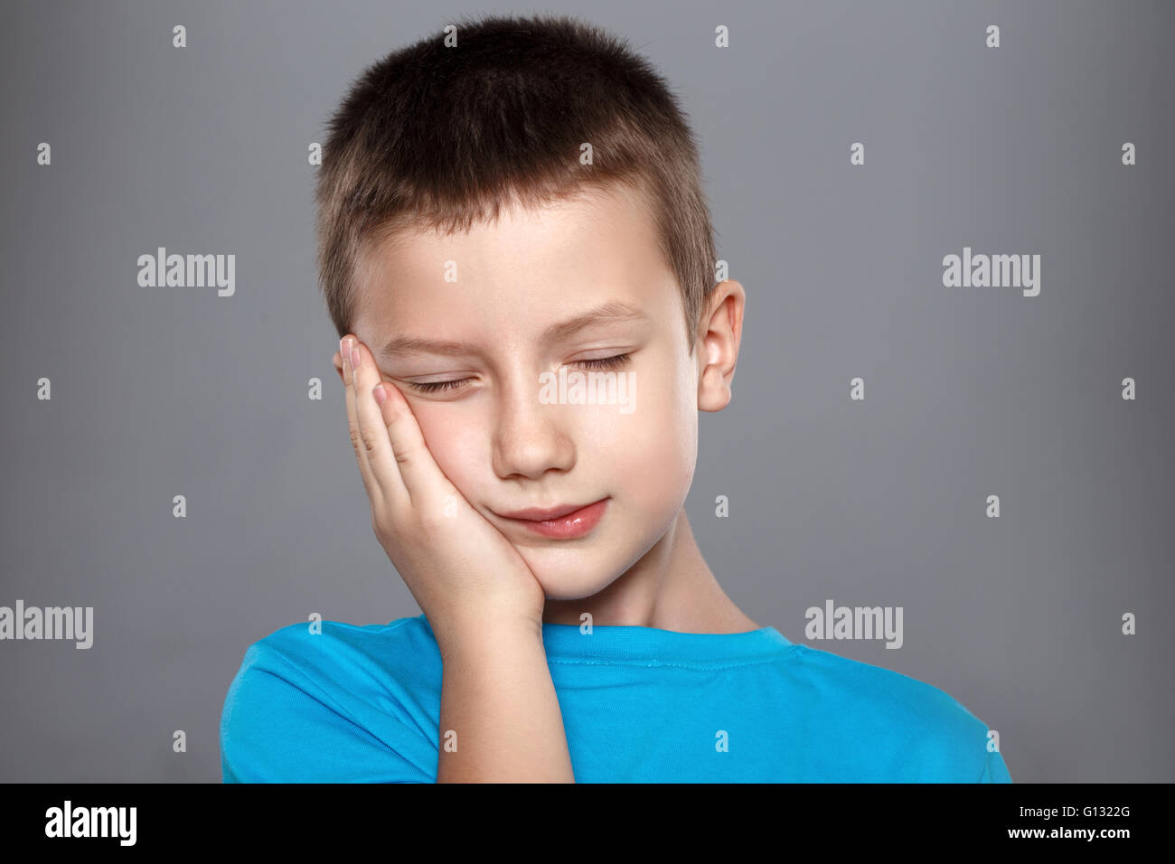 Closeup portrait of young boy with tooth ache. Problem about from oral ...