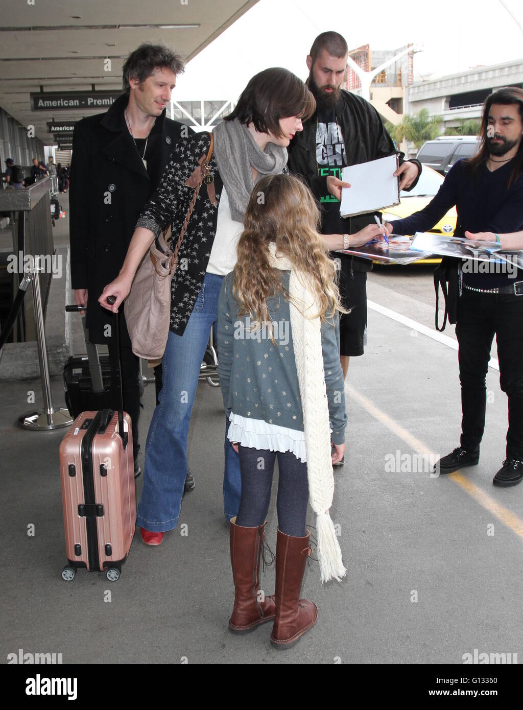 Milla Jovovich with Paul W. S. Anderson and daughter Ever Gabo Anderson ...