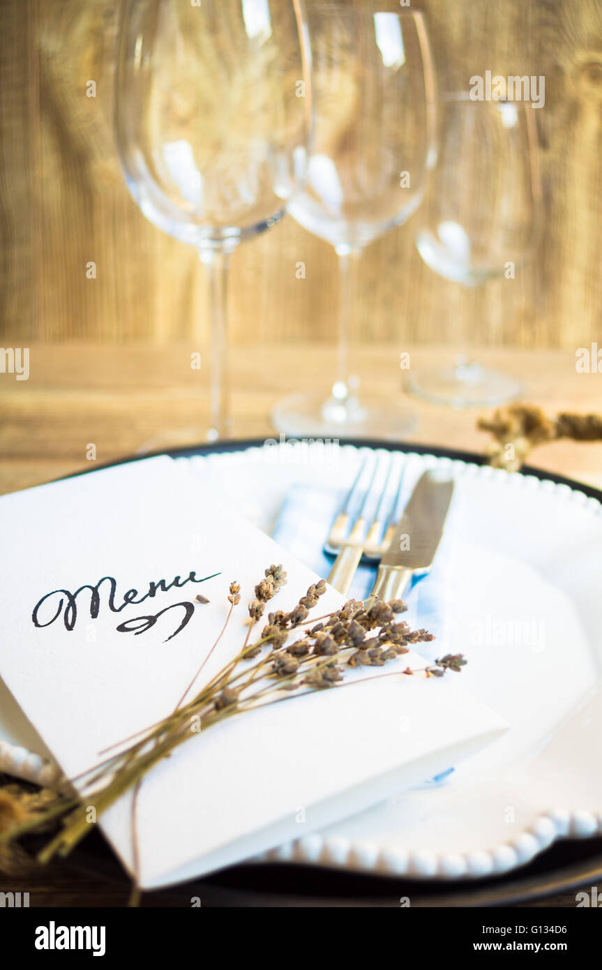 Table setting in rustic style with Menu Stock Photo - Alamy