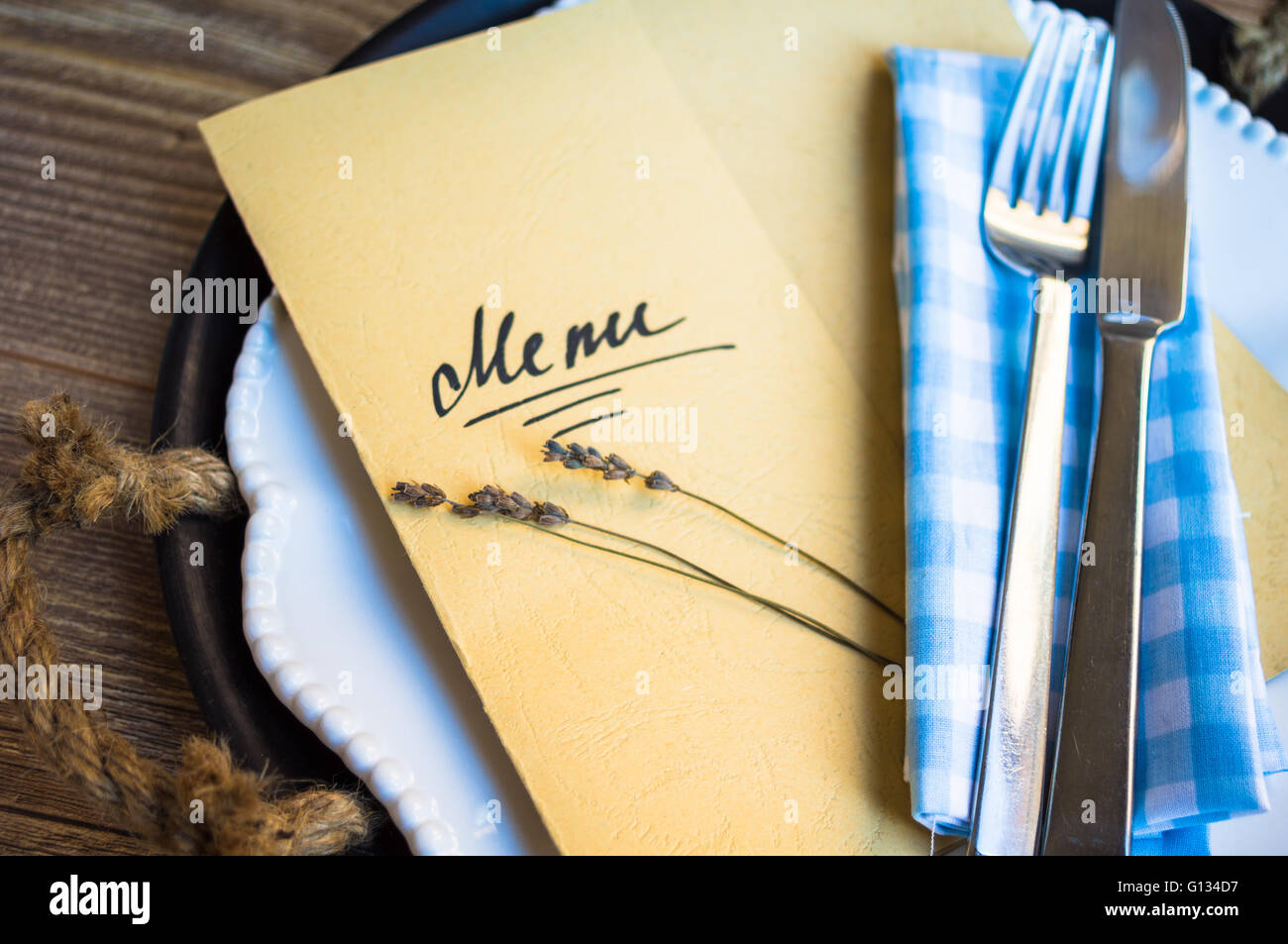 Table setting in rustic style with Menu Stock Photo - Alamy