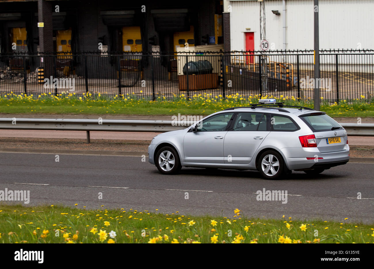 An unmarked Police Scotland police car speeding along the Kingsway West ...