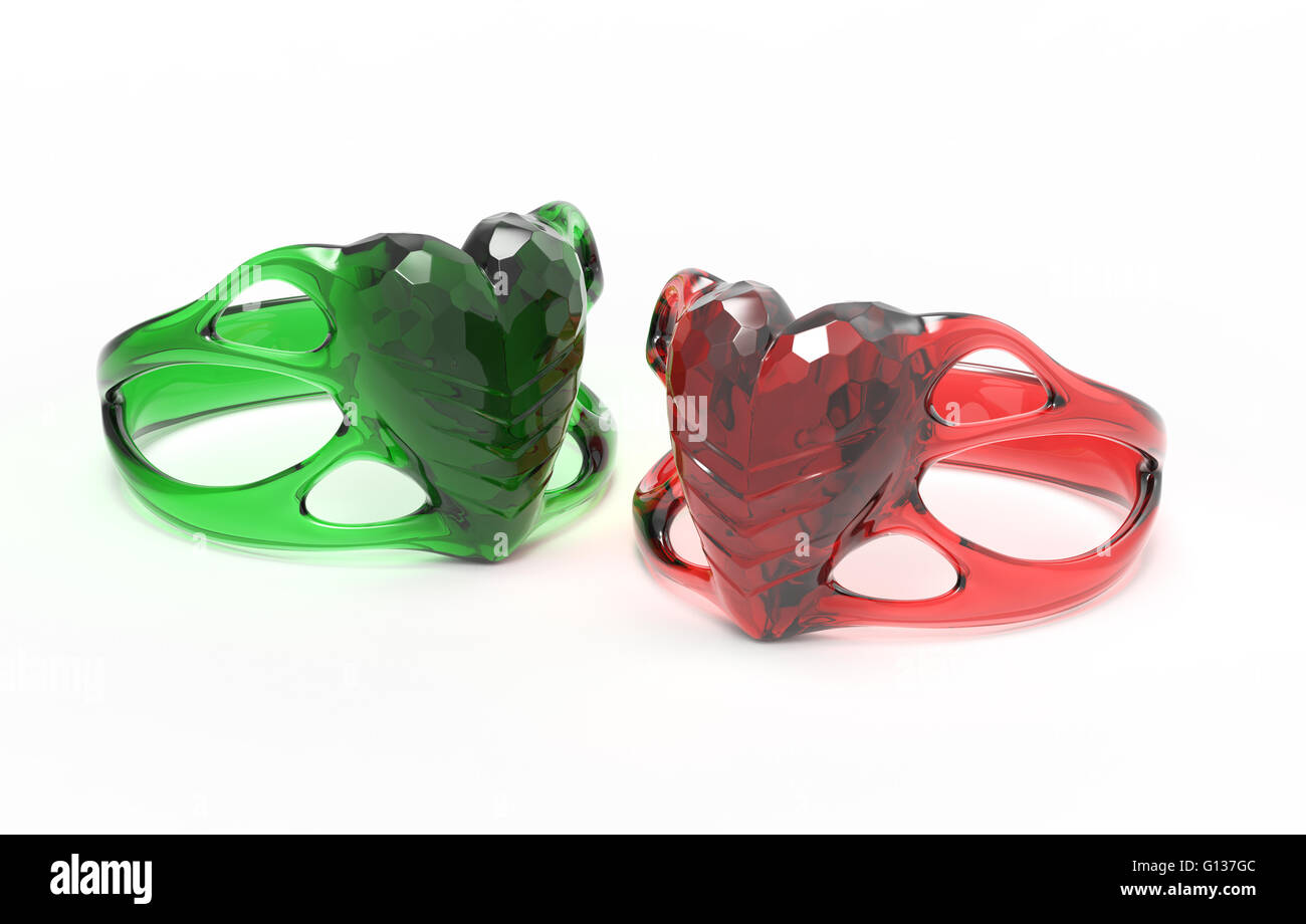 two transparent sculpted heart shaped wedding rings isolated on white ...