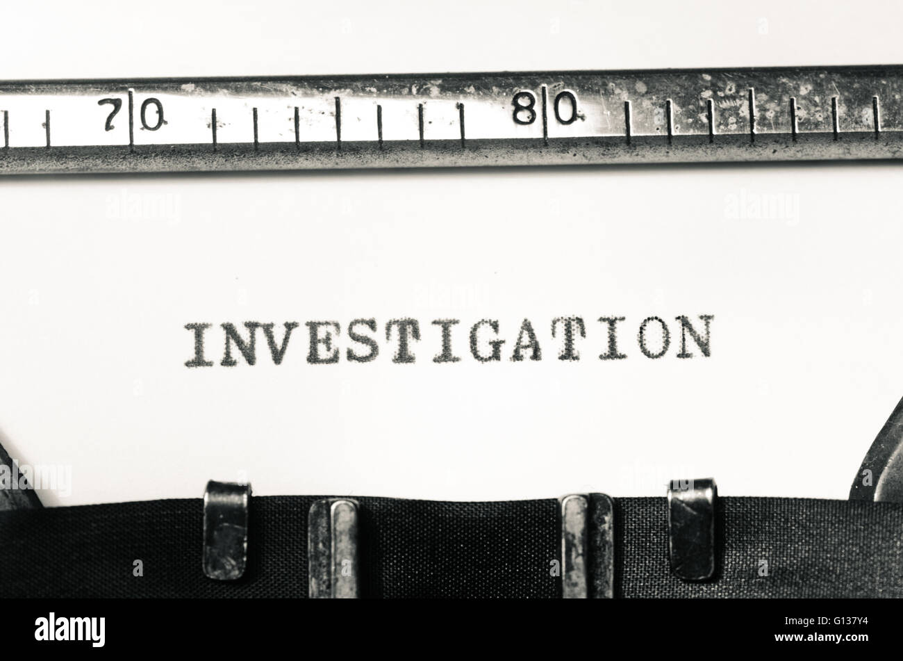 word investigation typed on an old typewriter Stock Photo - Alamy
