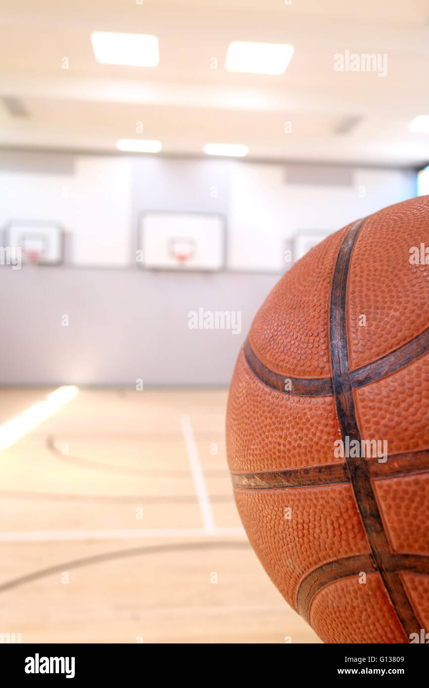 Basketball concept image, ball and baskets in a school gymnasium 8th ...