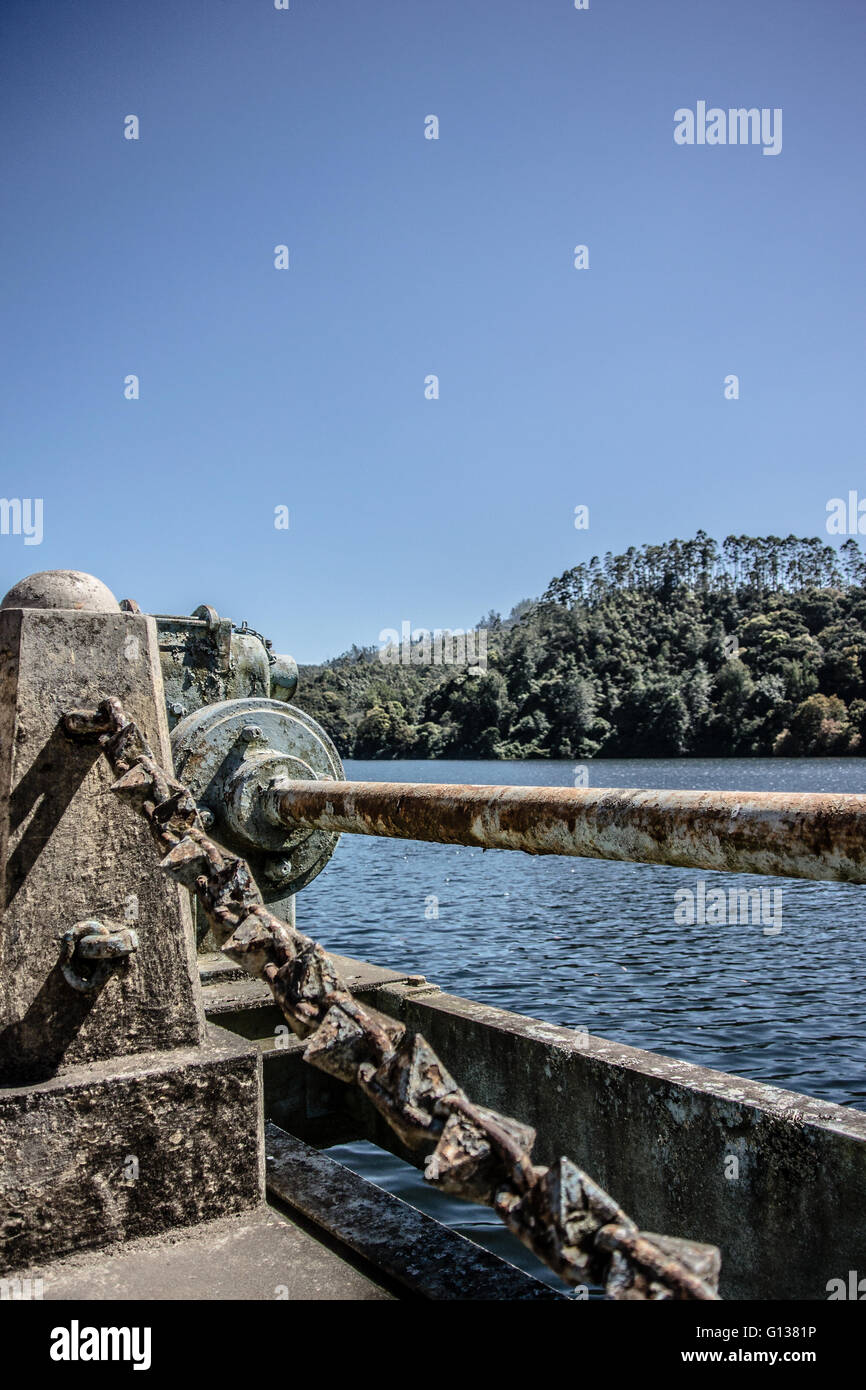 Rusted machinery and chain of the gravity fed dam on the Mattupetty ...