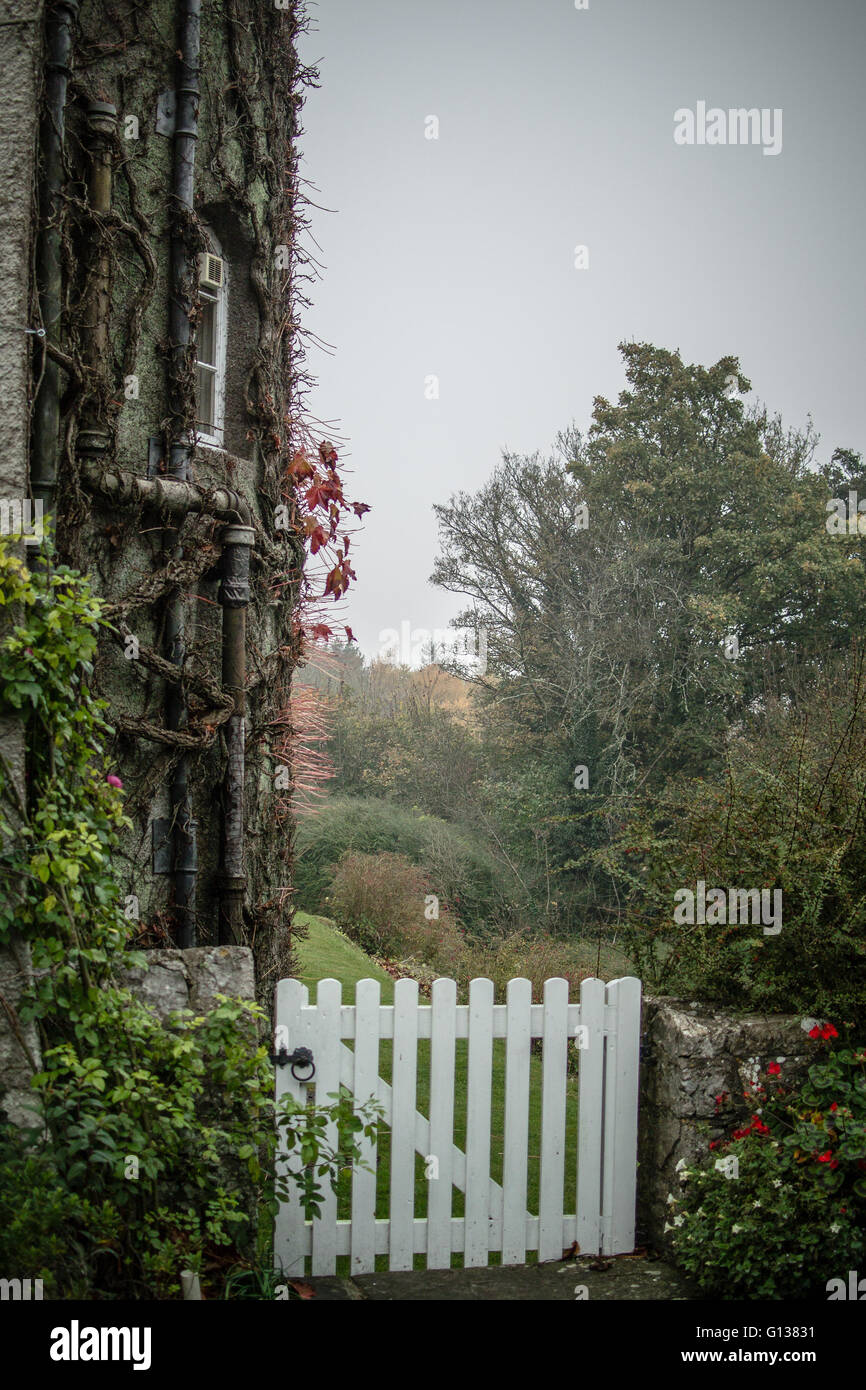 Small white gate leading to mature formal gardens behind Fonmon Castle ...