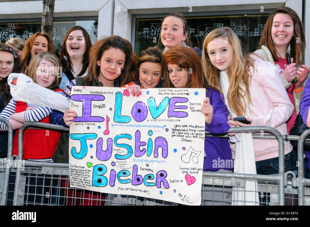 Teenage fans wait to try to catch a glimpse of Canadian pop singer ...