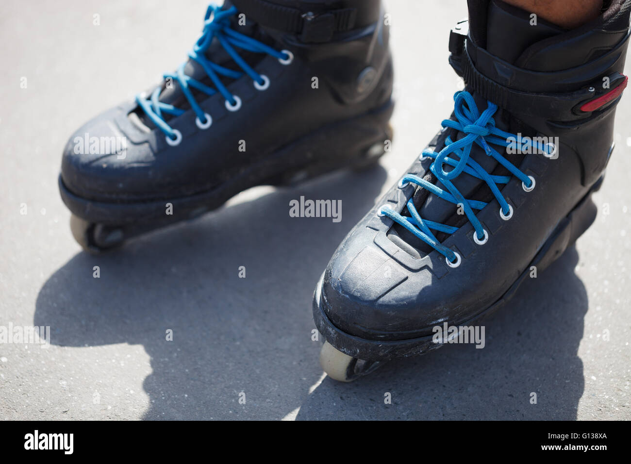 Rollerblader in professional extreme inline skates made for tricks ...