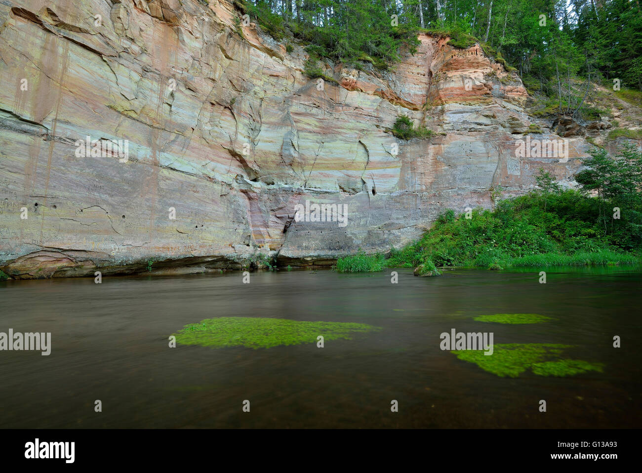 River flowing near the sandstone cliff Stock Photo - Alamy