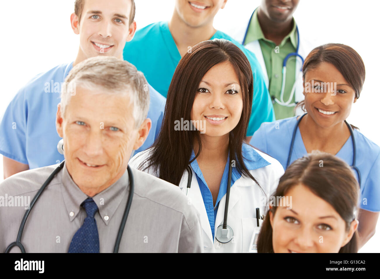 Multi-ethnic group of doctors, physicians, and nurses, both male and ...