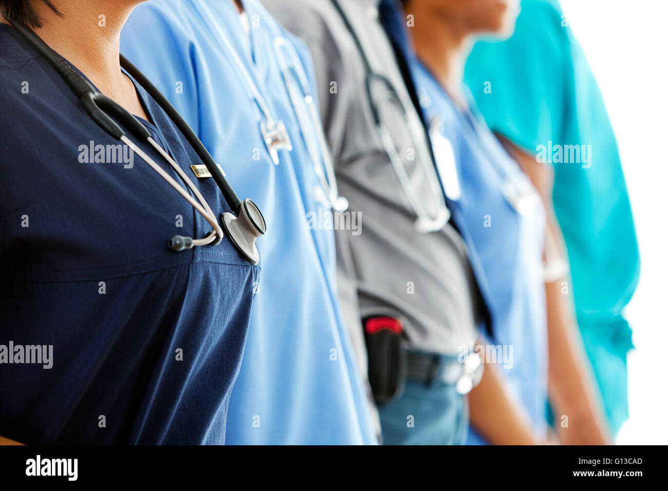 Multi-ethnic group of doctors, physicians, and nurses, both male and ...
