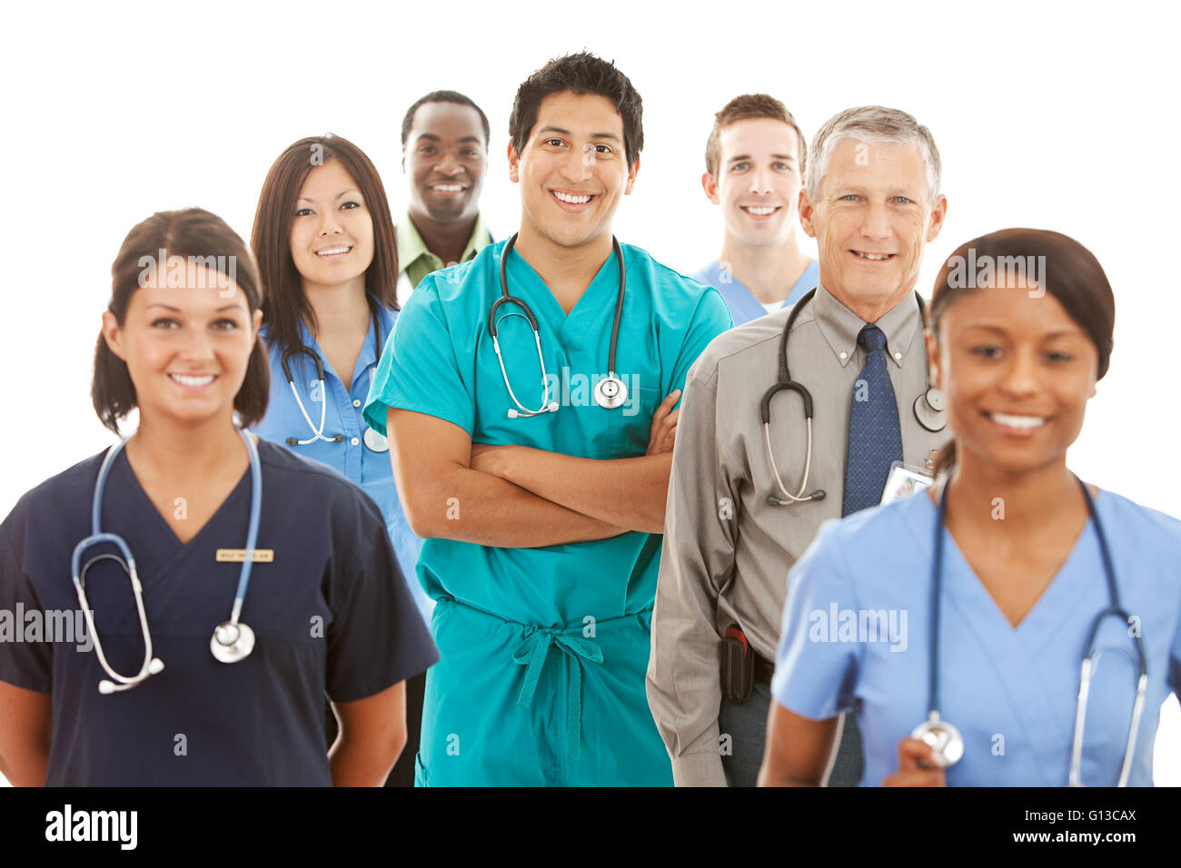 Multi-ethnic group of doctors, physicians, and nurses, both male and ...