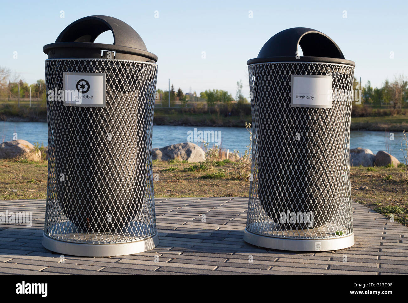 Recycle and waste disposal bins on Bow River path Stock Photo - Alamy