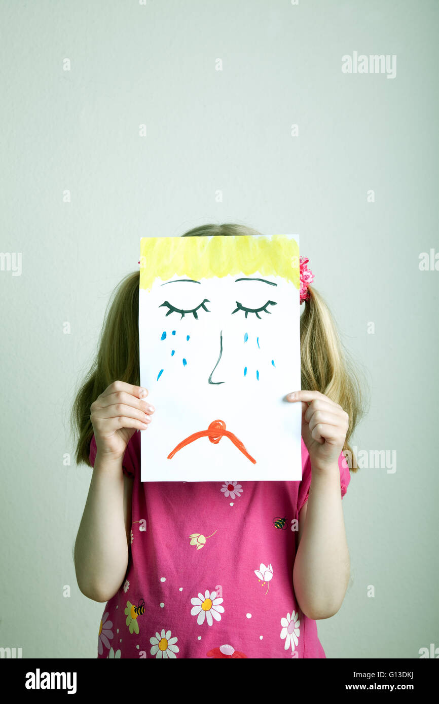 Little Girl with Painted Mask with happy and sad face Stock Photo - Alamy