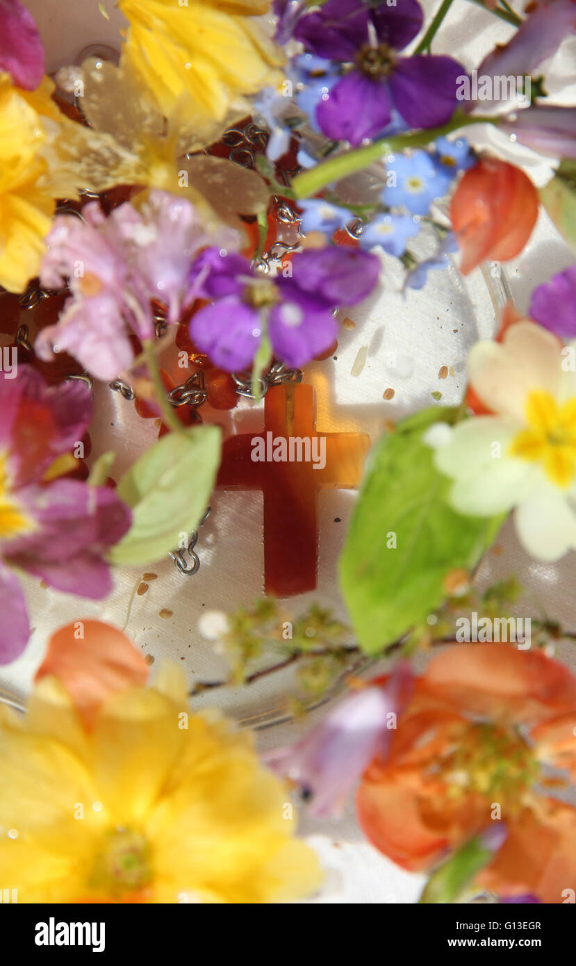 Rosalia catholic rosary in bowl of flower petals, celebrating ascension ...