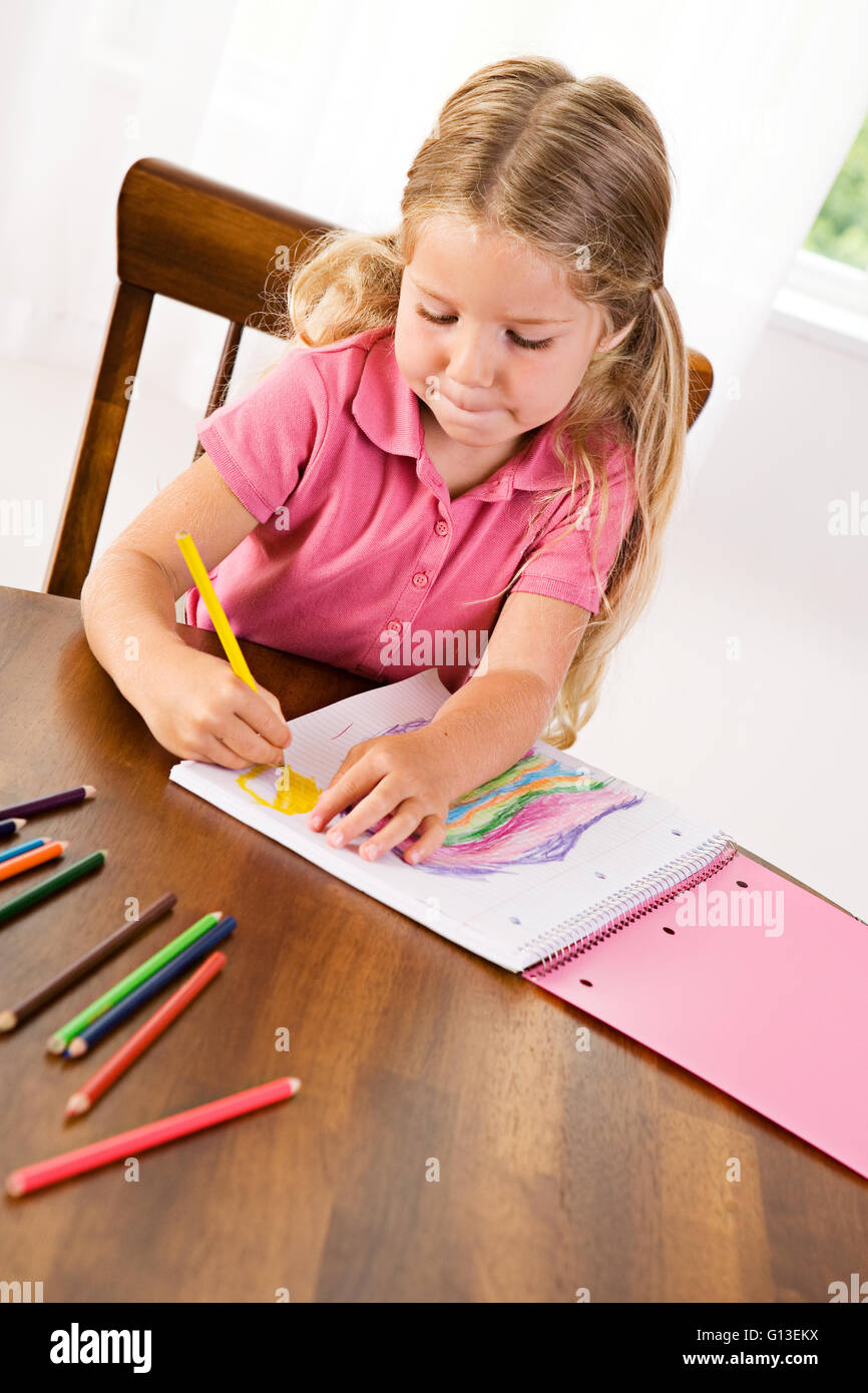 Little girl with school supplies, doing homework, etc Stock Photo - Alamy