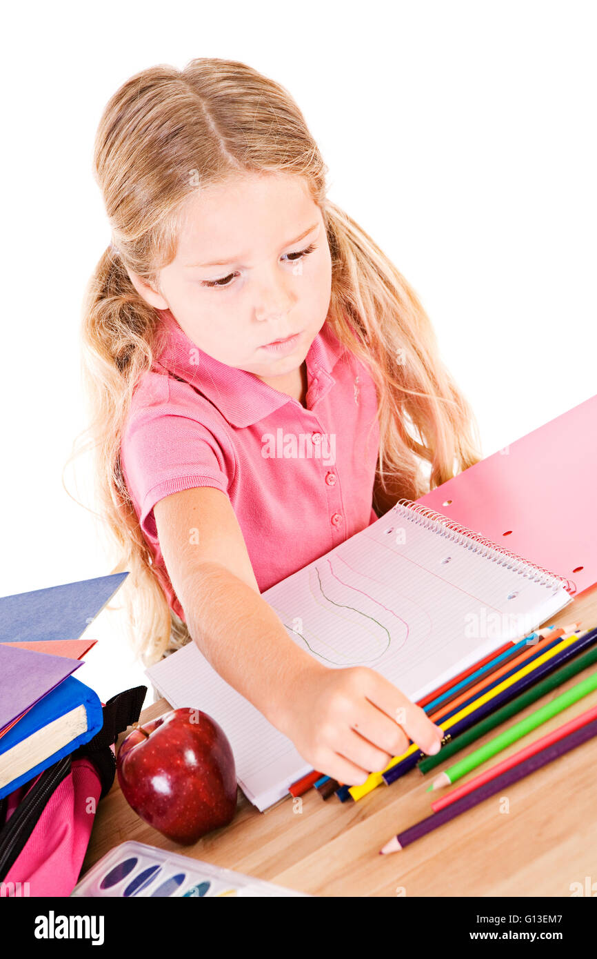 Little girl with school supplies, doing homework, etc Stock Photo - Alamy