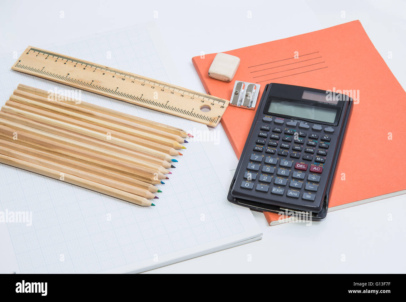 The concept of learning shown with a calculator & pencils on a ...