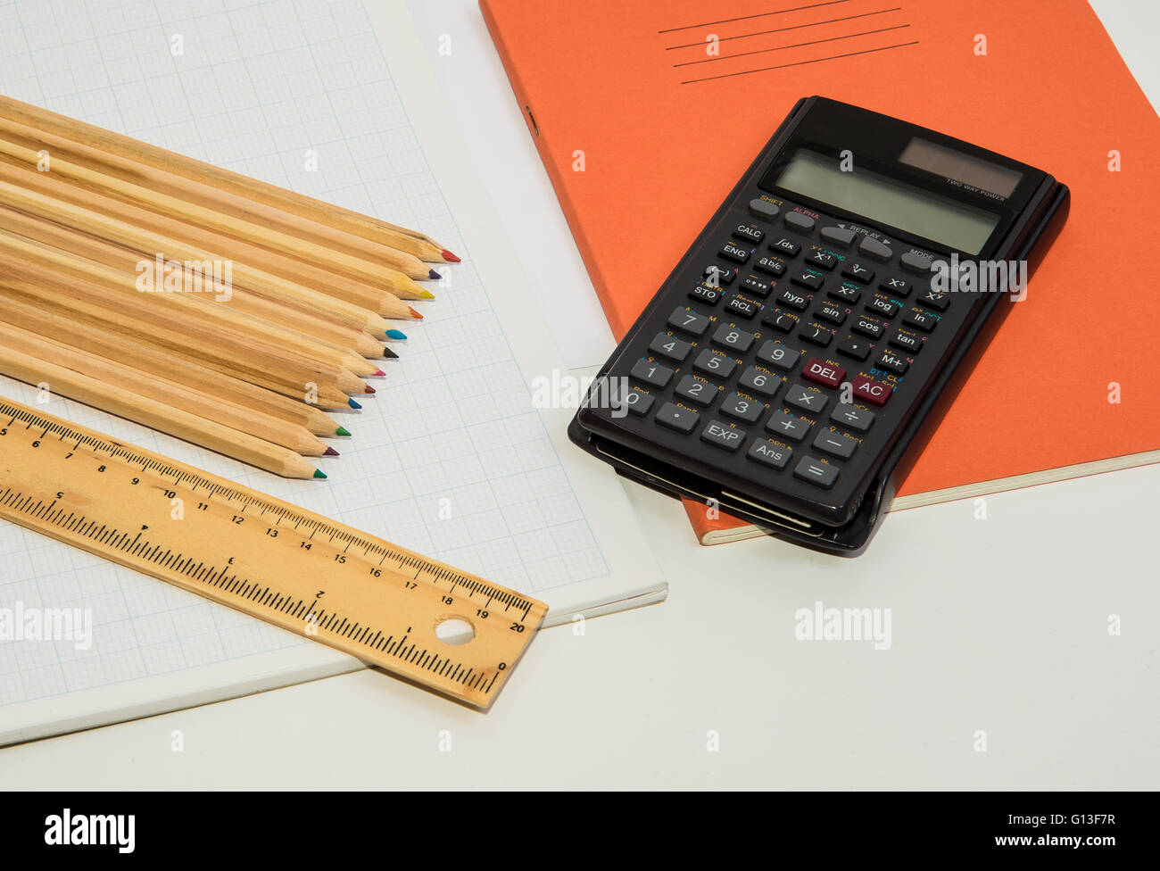 The concept of learning shown with a calculator & pencils on a ...