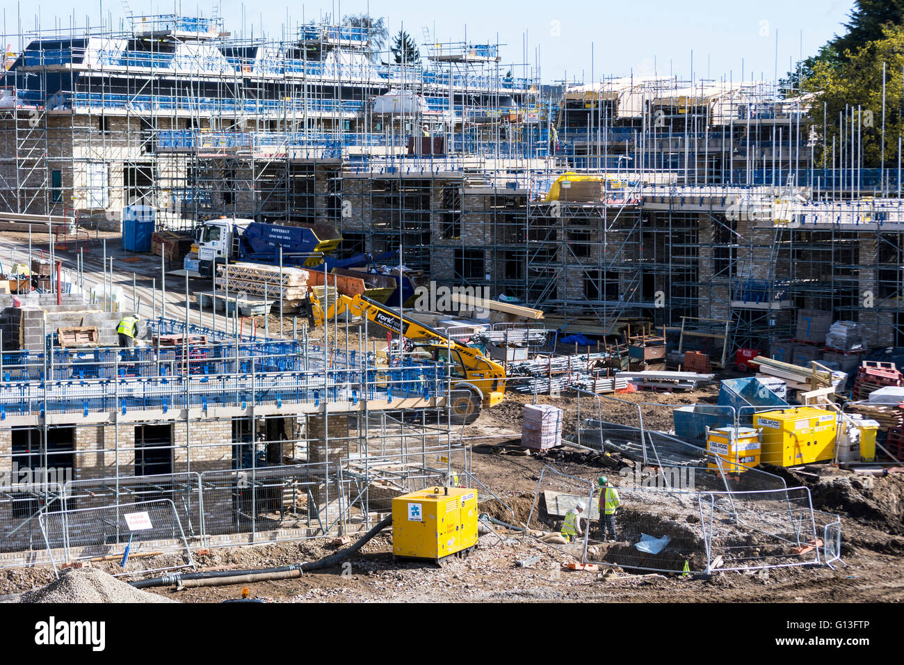 Construction site of new homes in London England. Workers working on ...