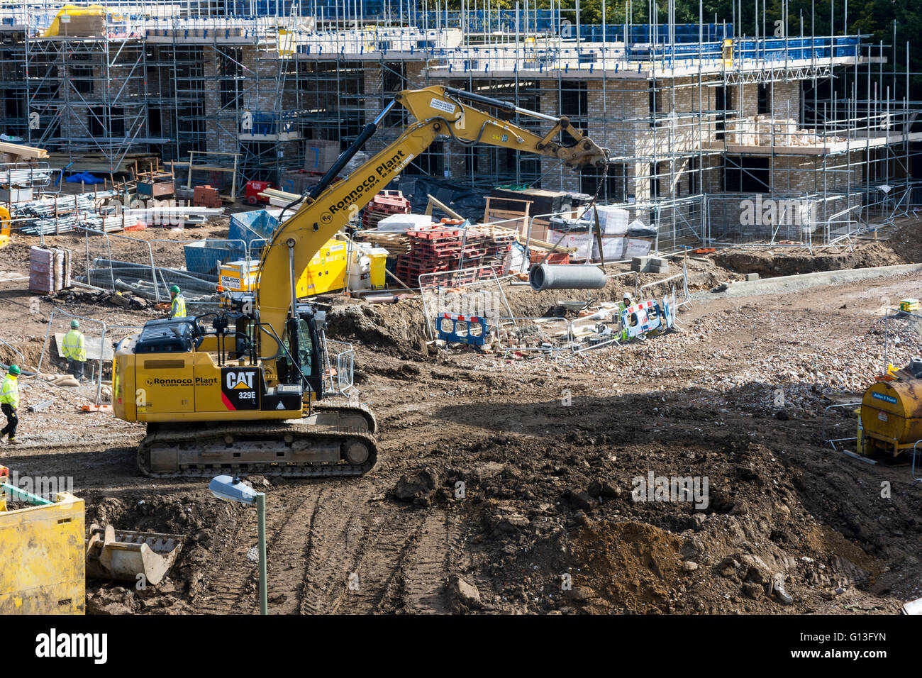 Construction site of new homes in London England. Workers working on ...